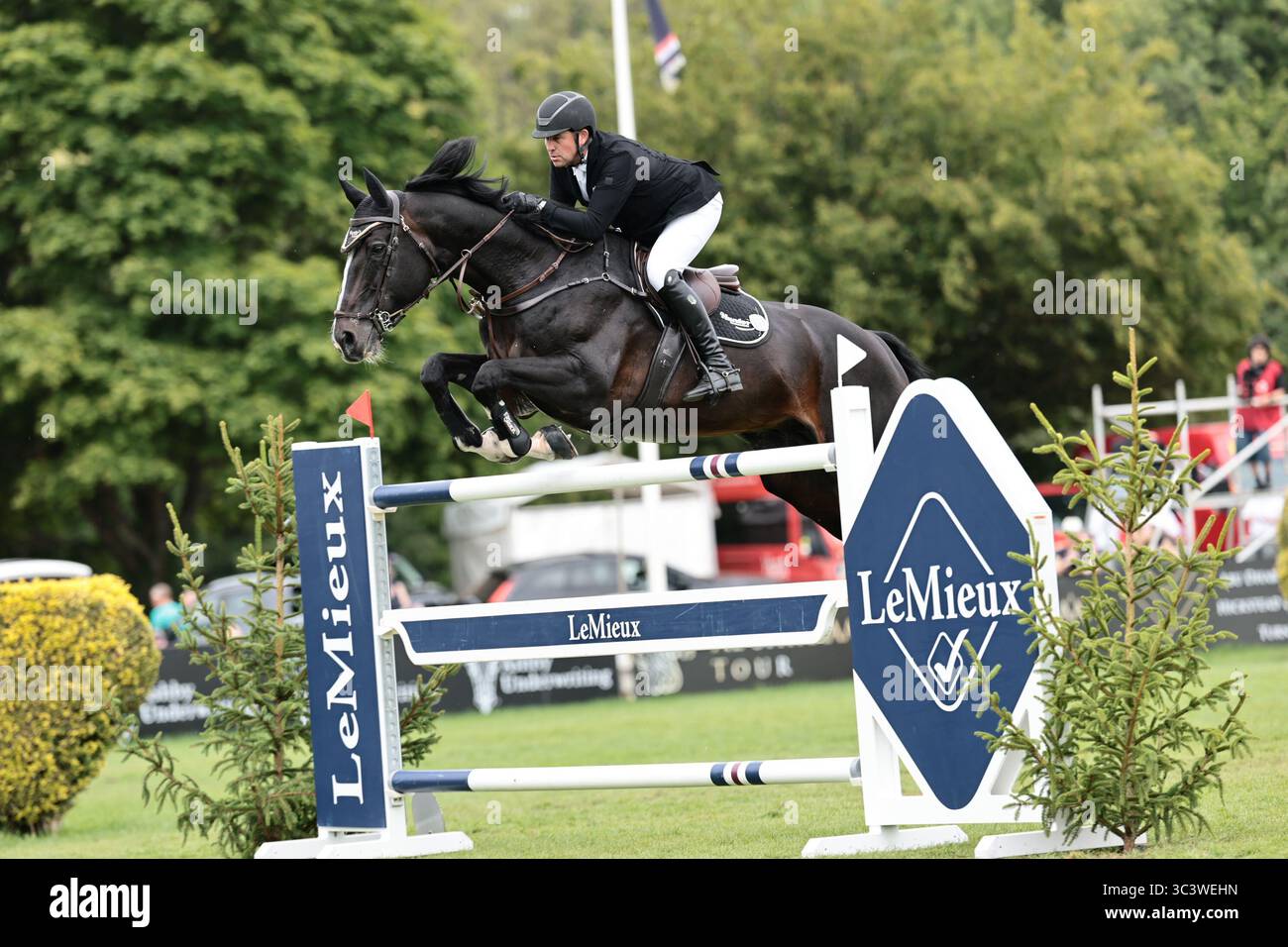Simon Crippen of Great Britain riding Handsome during the first round ...