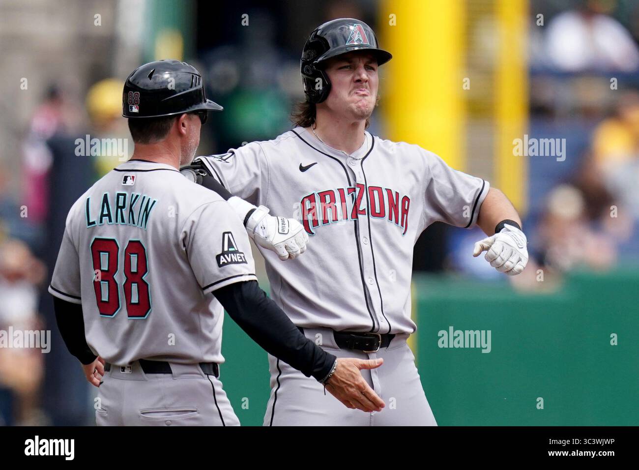 Arizona Diamondbacks' Jake McCarthy, right, celebrates next to third ...