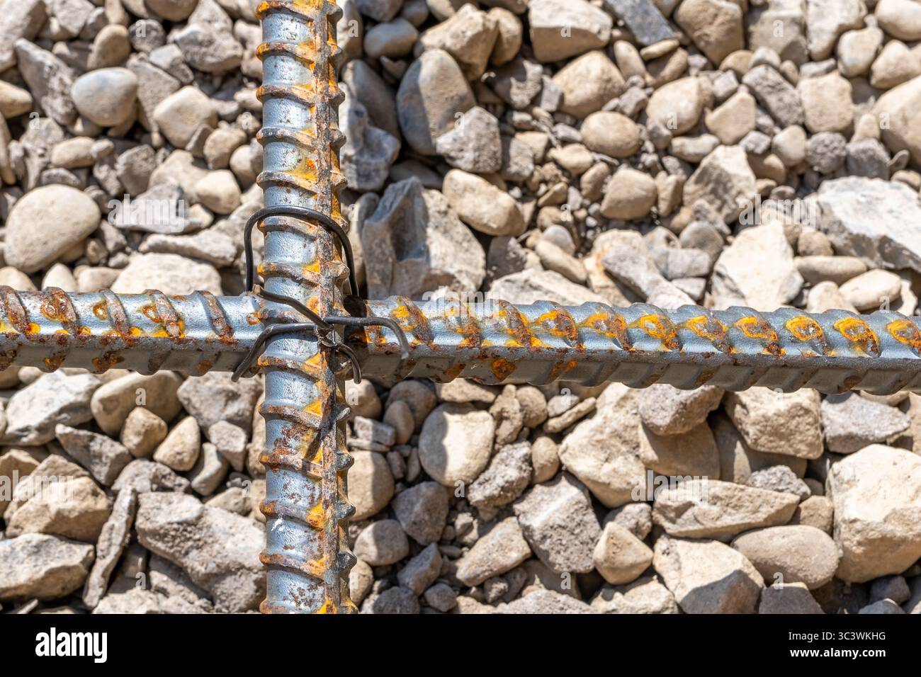 Rebar tied together, over stone base prior to concrete being installed ...
