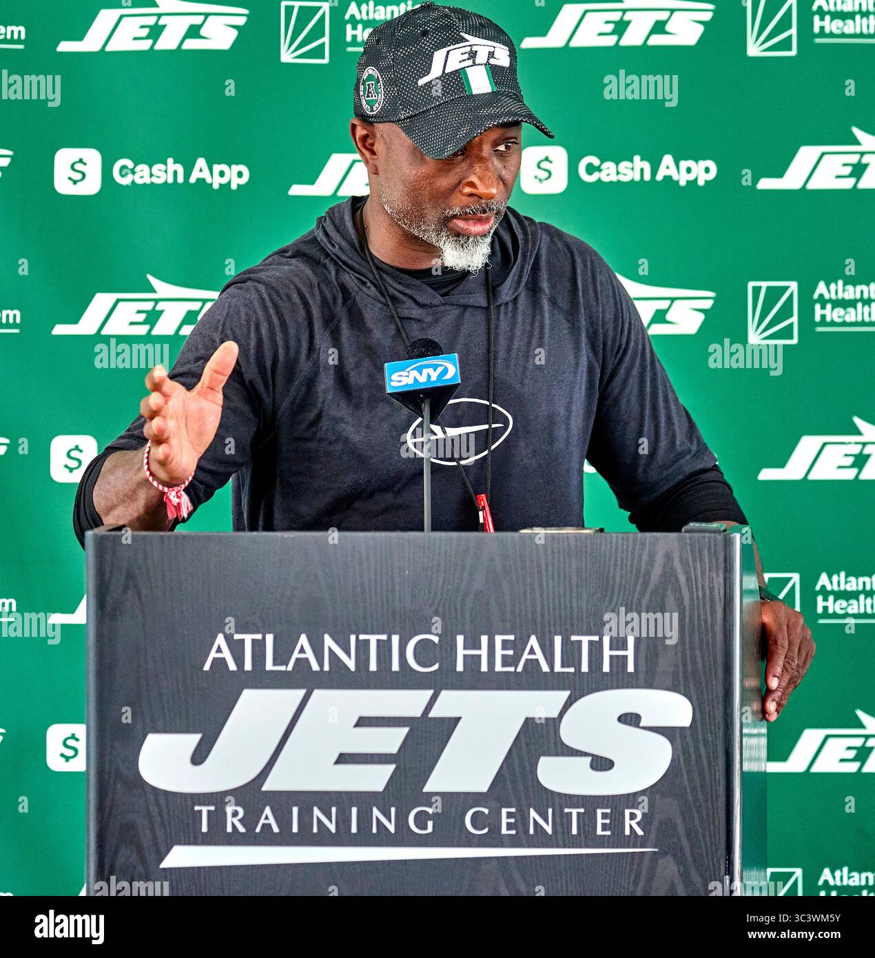 New York Jets head coach Aaron Glenn talks with media during training ...