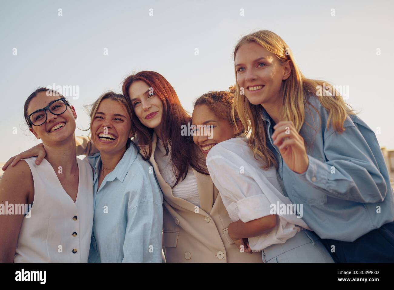 Group friends enjoying warm hi-res stock photography and images - Alamy