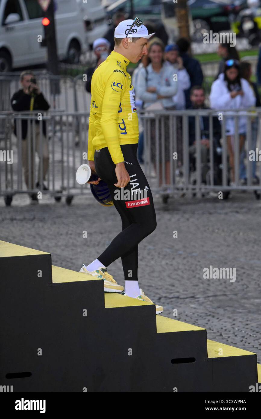 Slovenia's Tadej Pogacar, the Tour de France winner, walks from the ...