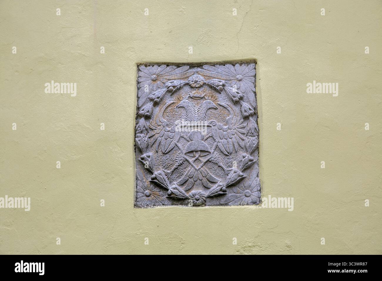 Historic heraldic stone relief featuring crown, eagles and decorative ...