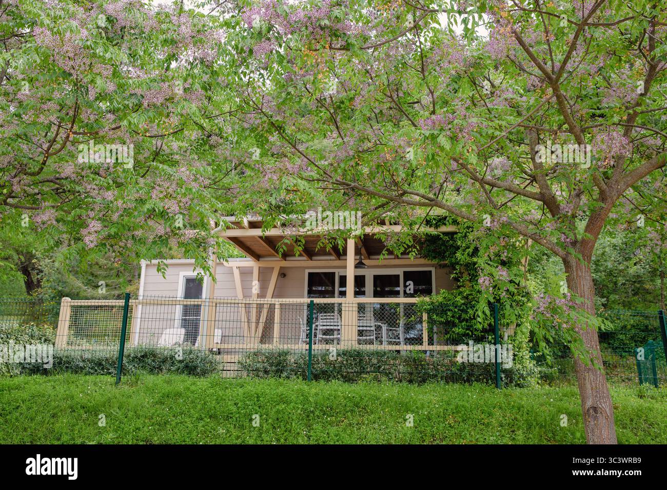 Contemporary residential building mobile home with wooden pergola and ...