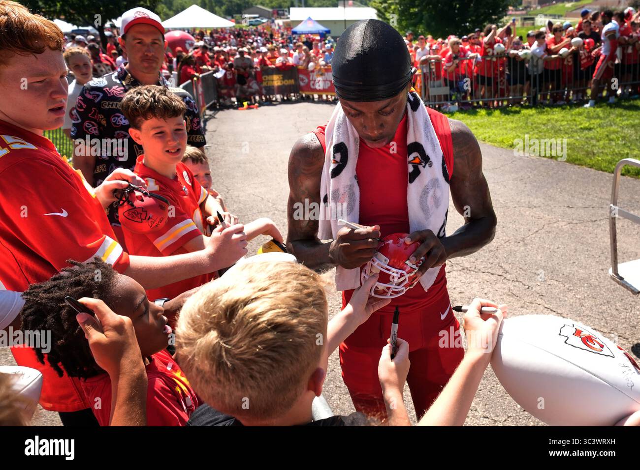 Kansas City Chiefs wide receiver Xavier Worthy signs autographs during ...