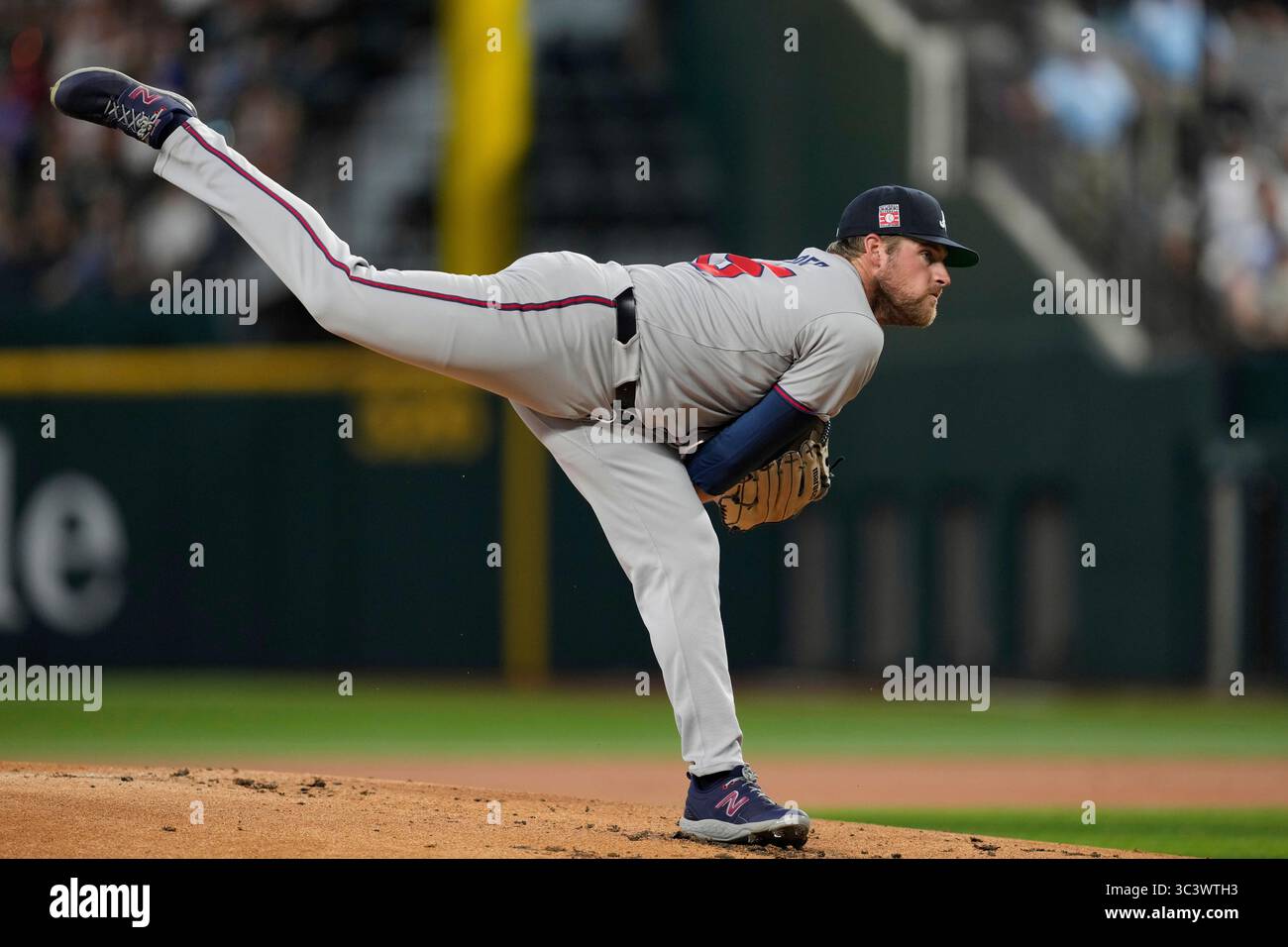 Atlanta Braves starting pitcher Bryce Elder follows through on his delivery to the Texas Rangers ...