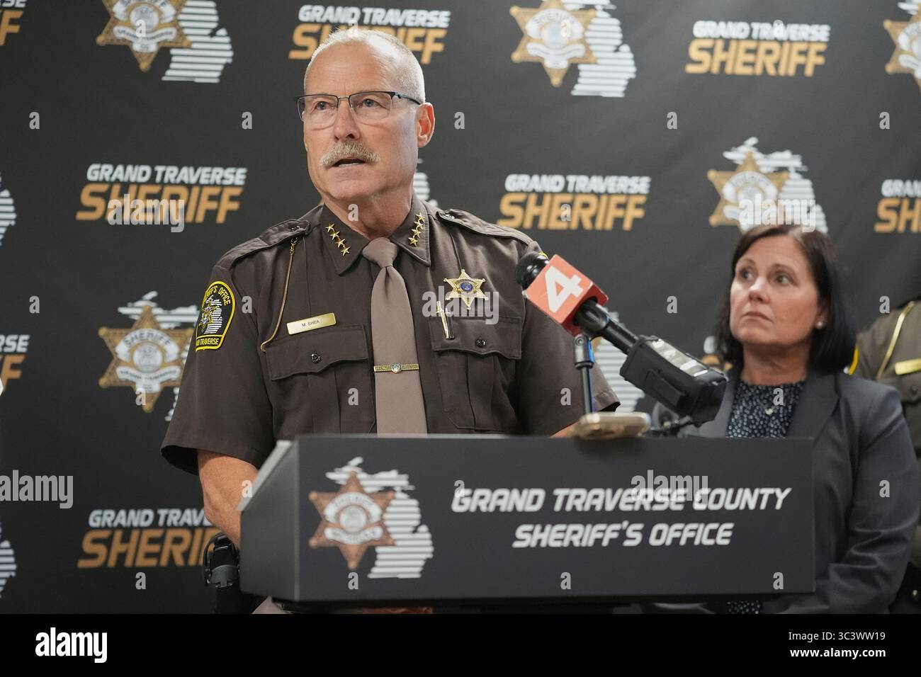 Grand Traverse County Sheriff Mike Shea, left, speaks alongside ...