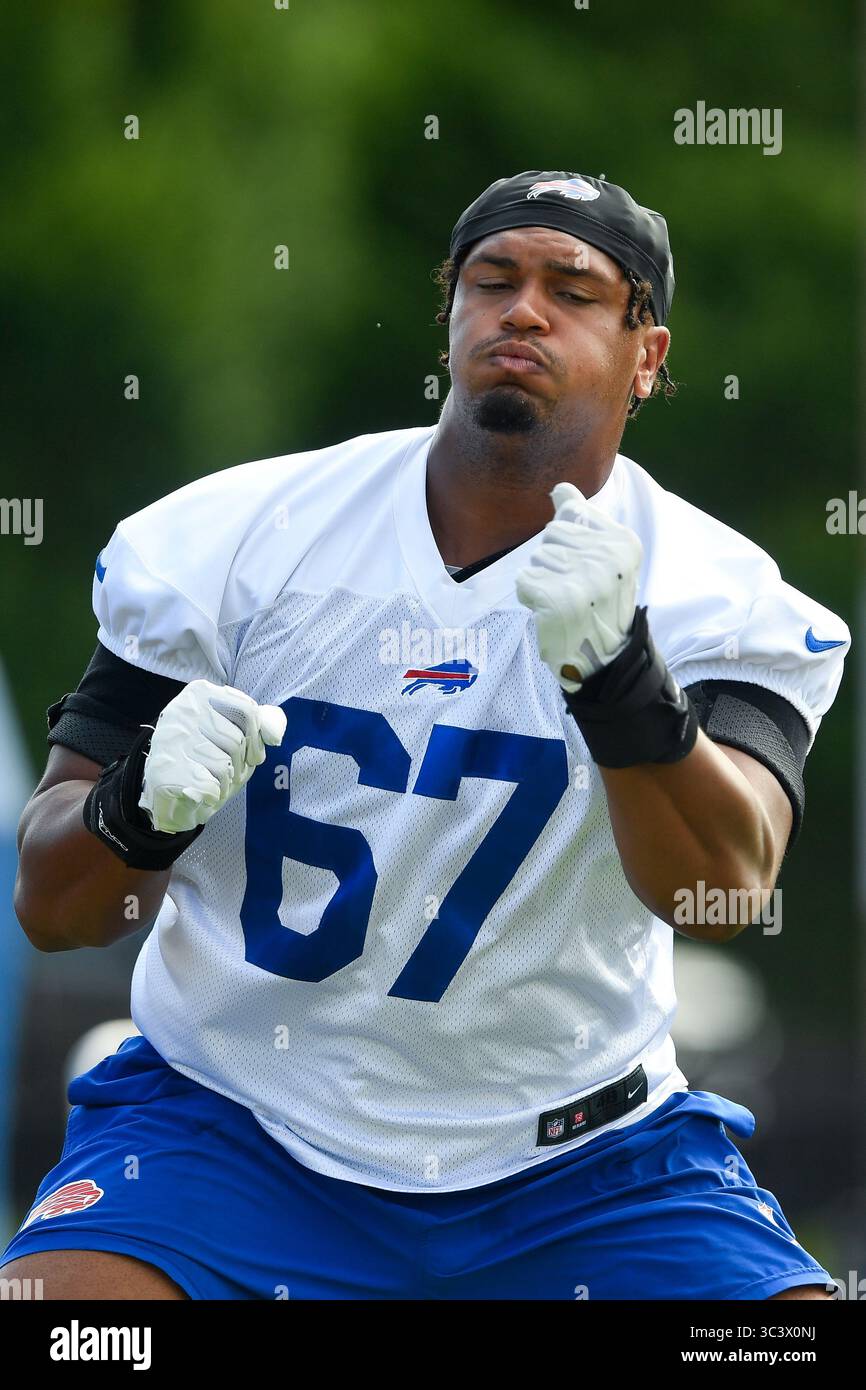 Buffalo Bills tackle Travis Clayton (67) warms up during practice at ...