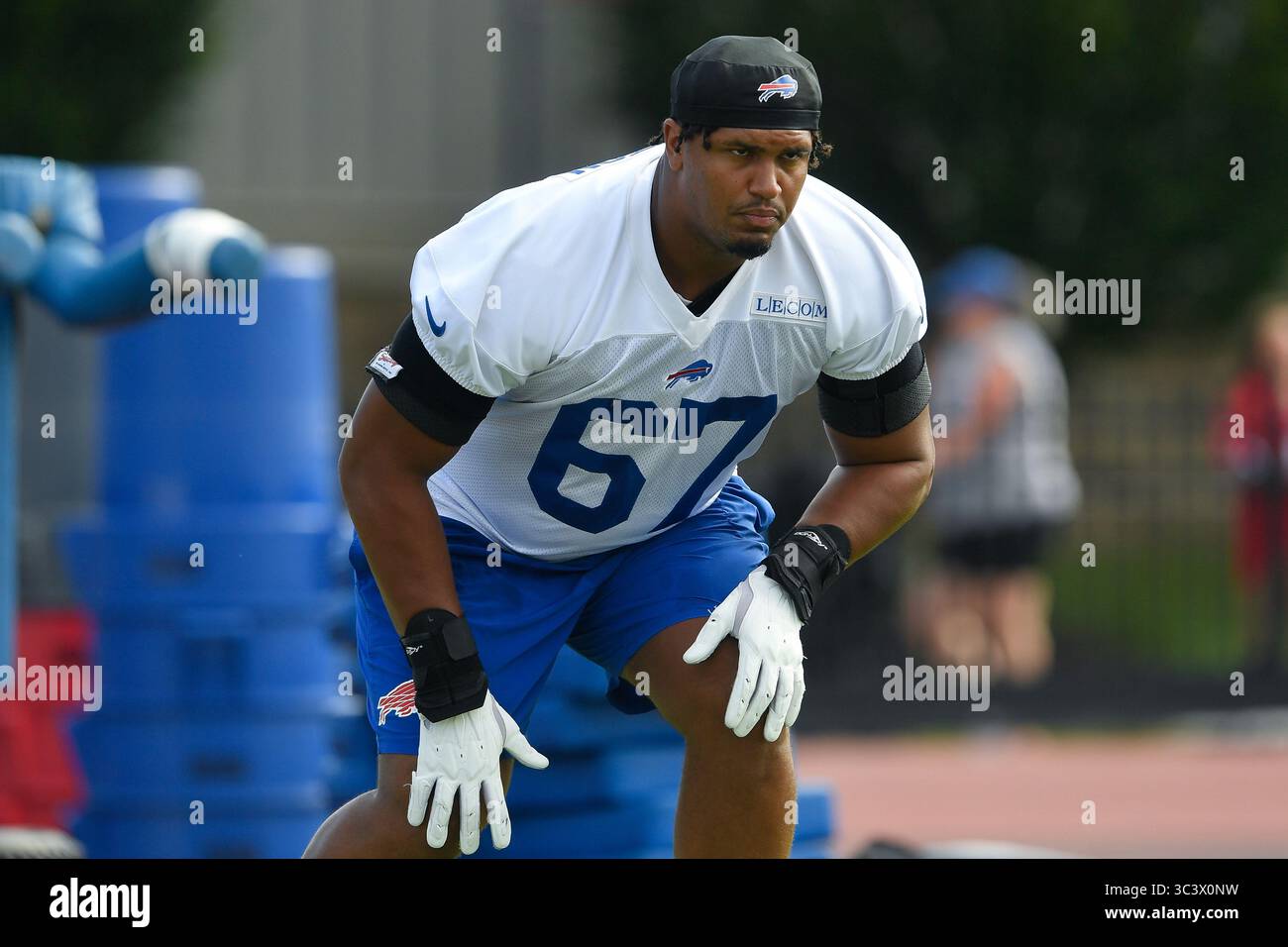Buffalo Bills tackle Travis Clayton (67) warms up during practice at ...