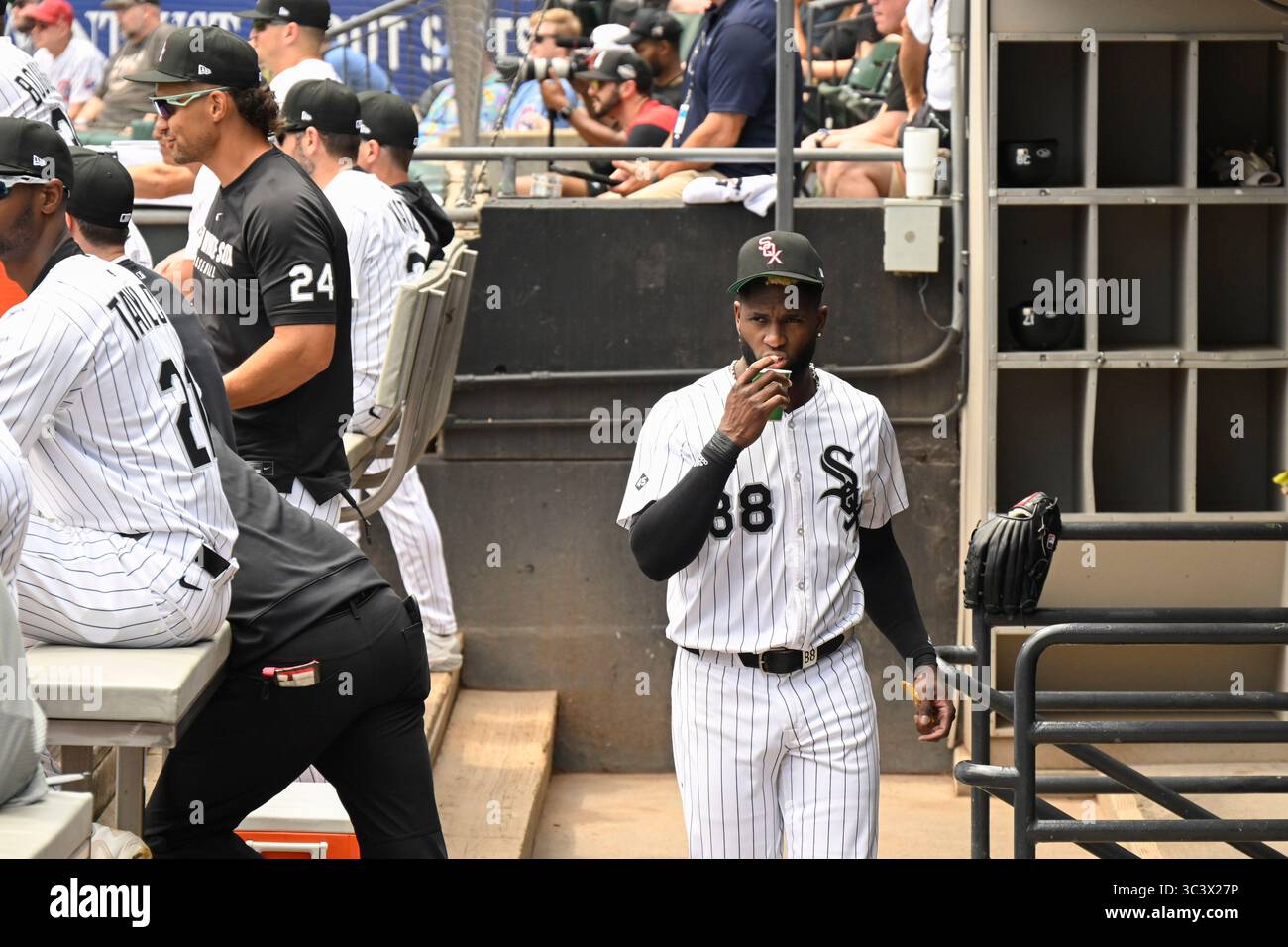 Chicago White Sox outfielder Luis Robert Jr. looks on from the dugout ...