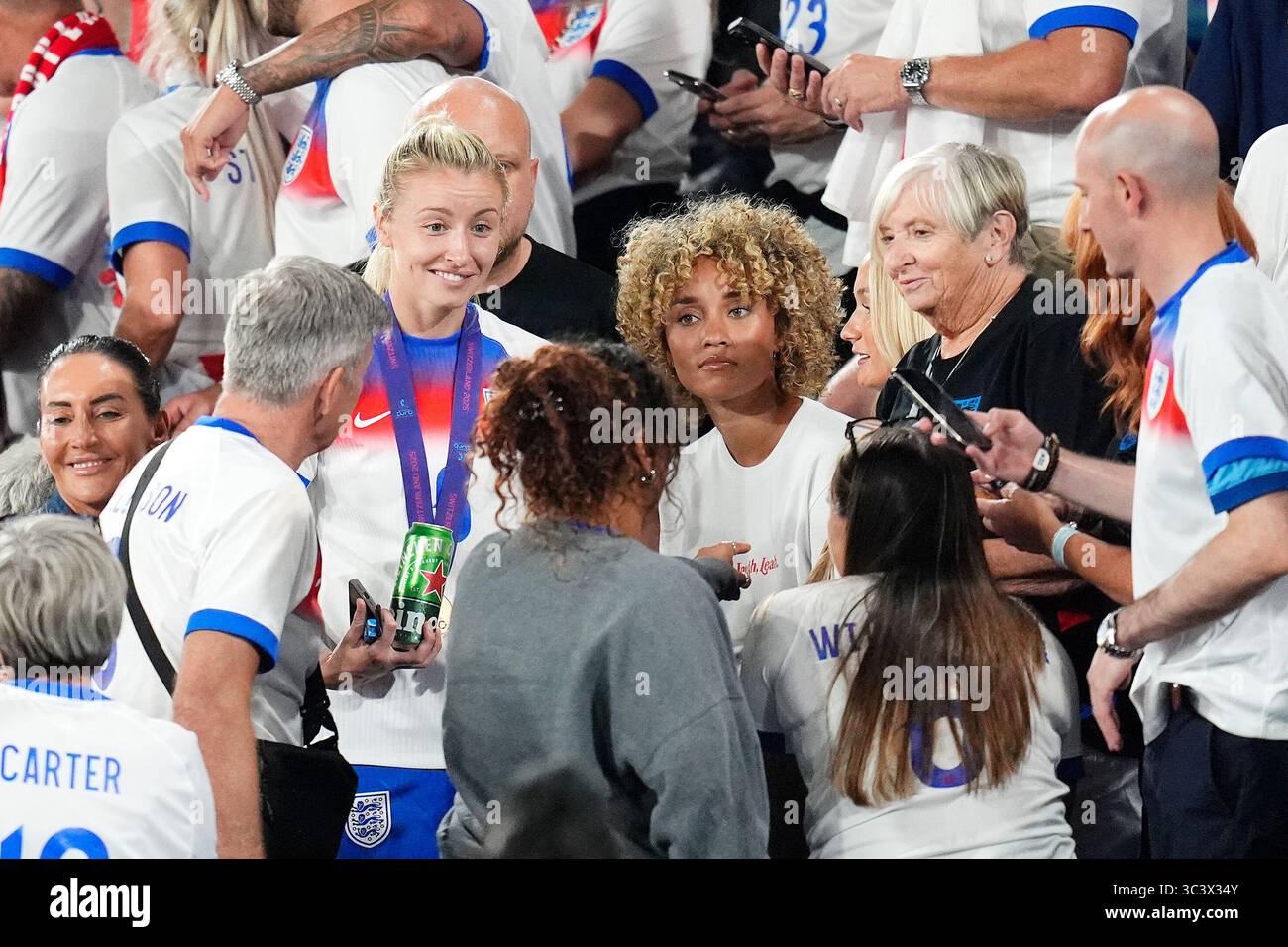 England's Leah Williamson (centre left) with partner Elle Smith after ...