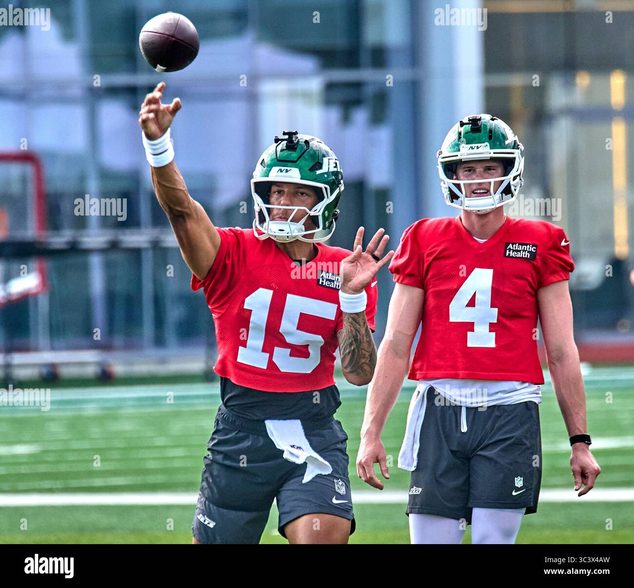 New York Jets quarterback Adrian Martinez (15) throws during drills as ...