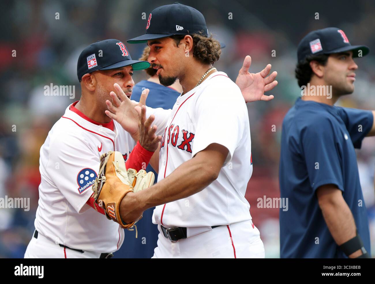 Boston Red Sox pitcher Jordan Hicks, center, is congratulated by ...