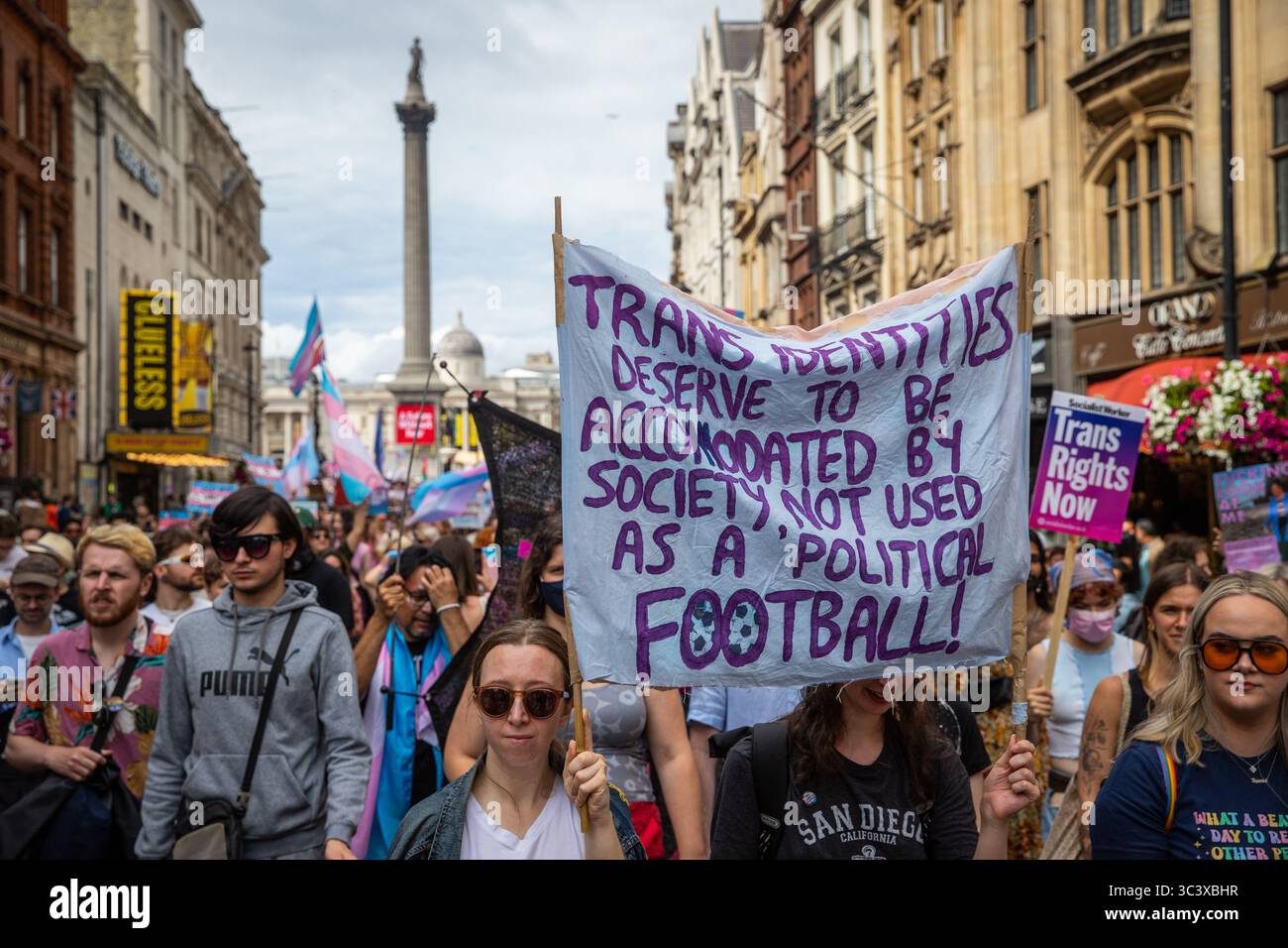 London Trans Pride 2025 in Whitehall with banners and placards Stock ...