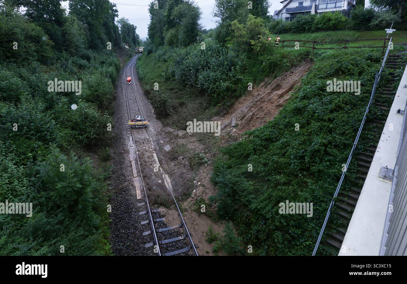 20 July 2025, Baden-Württemberg, Riedlingen: Earth lies on the tracks ...