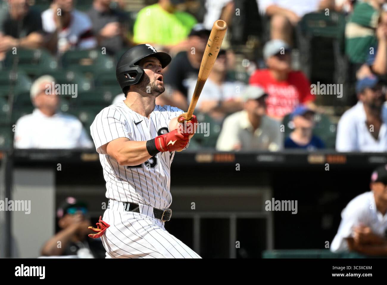 Chicago White Sox's Andrew Benintendi watches his three-run home run ...