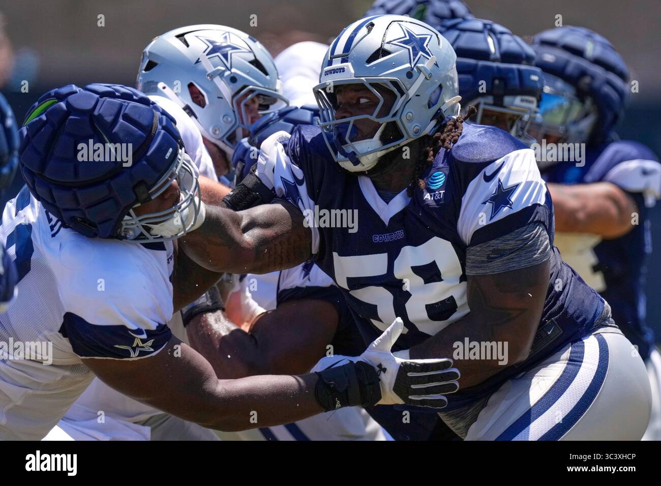Dallas Cowboys guard Tyler Booker, left, and defensive tackle Mazi ...