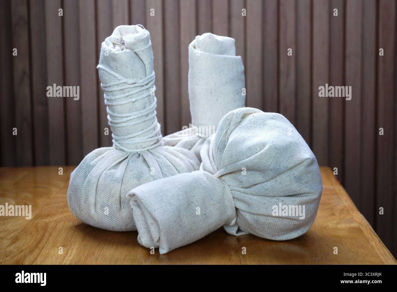 herbal compress ball, thai traditional massage Stock Photo - Alamy