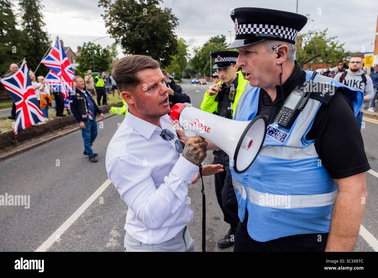 Altrincham, UK. 27 JUL, 2025. Prominent activist Ryan Ferguson attempts ...
