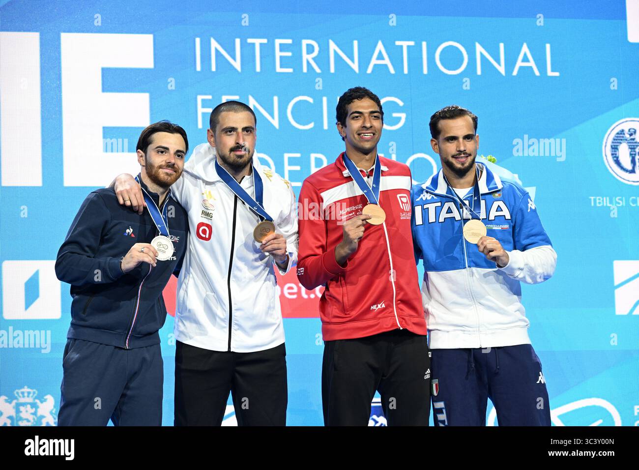 Champion Georgia's Sandro Bazadze (2nd L) poses with second place ...