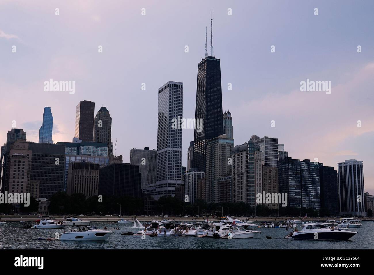 Boaters gather off Oak Street Beach on Lake Michigan, also known as the ...