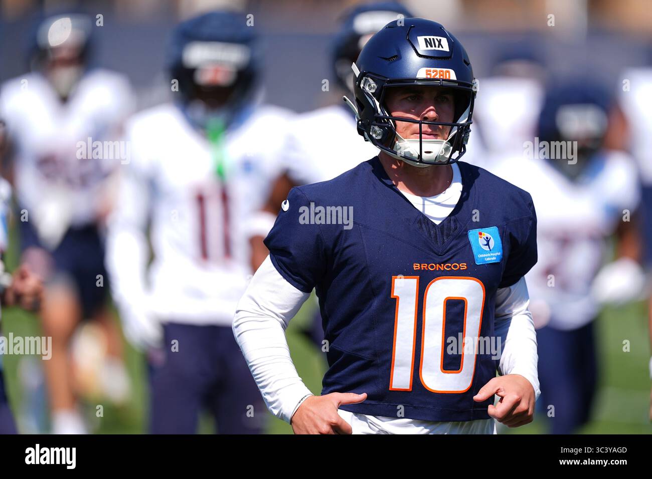 Denver Broncos quarterback Bo Nix (10) takes part in drills during an NFL football practice ...