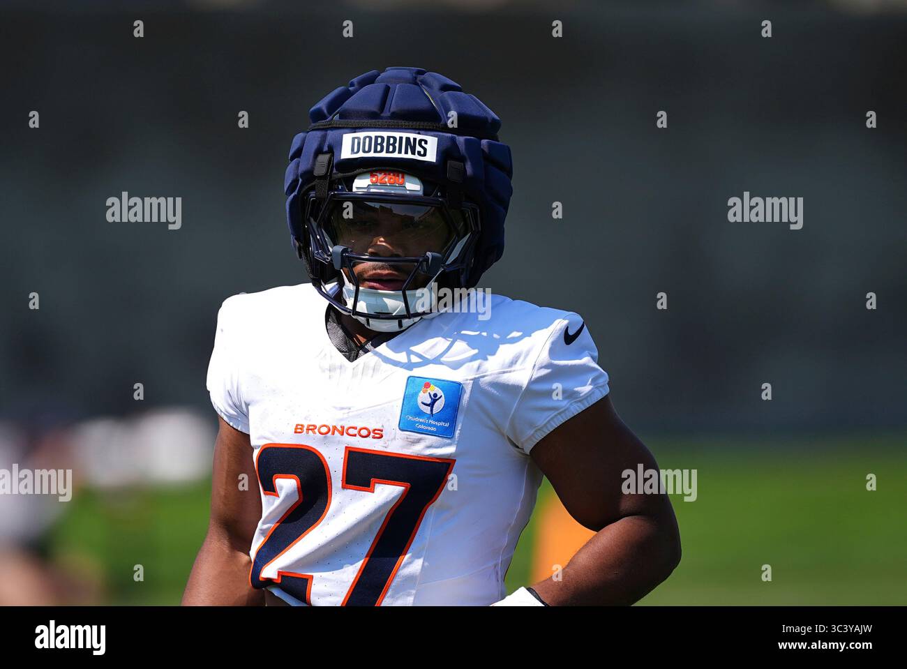 Denver Broncos running back J.K. Dobbins takes part in drills during an NFL football practice ...