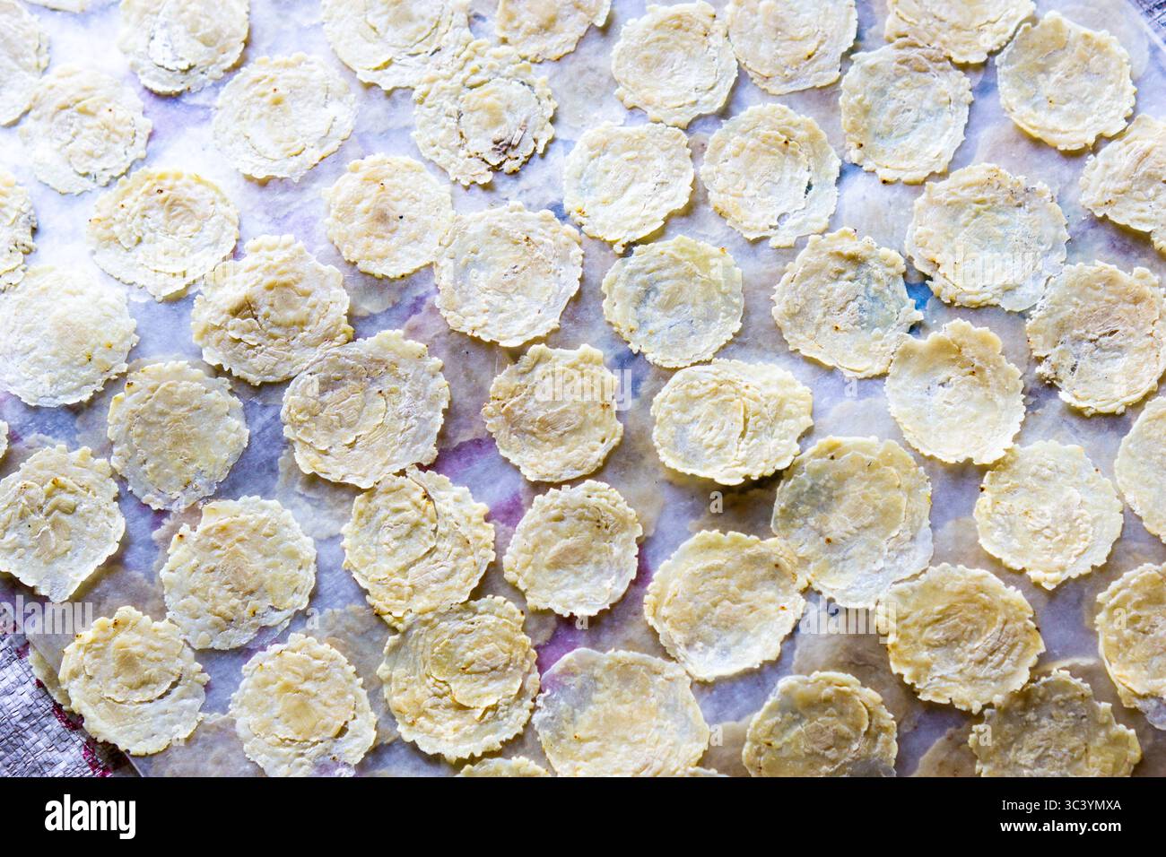 The process of making emping melinjo (melinjo chips). It tastes a ...
