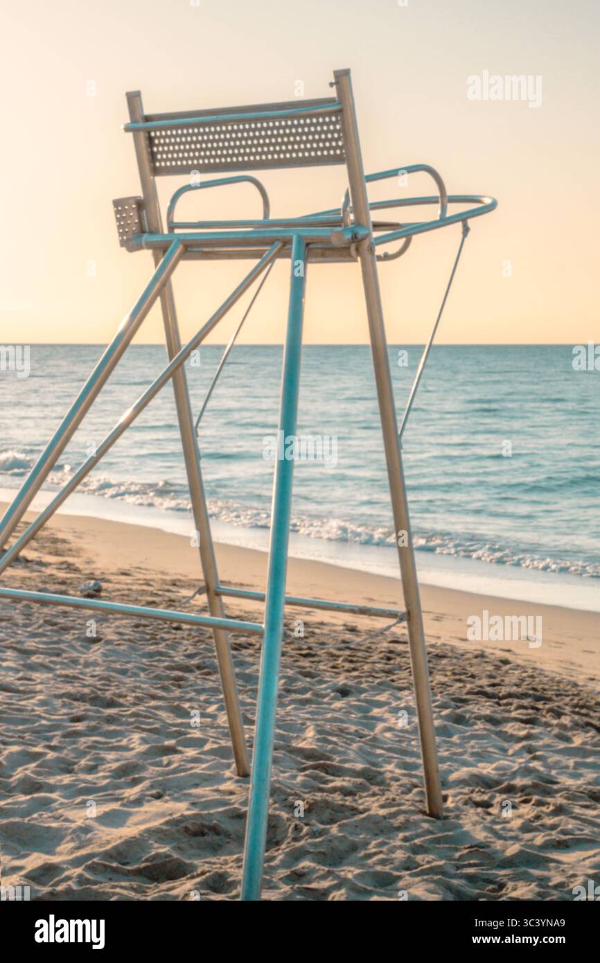 Metal Lifeguard Chair On Sandy Beach With Ocean Waves. Beach safety ...