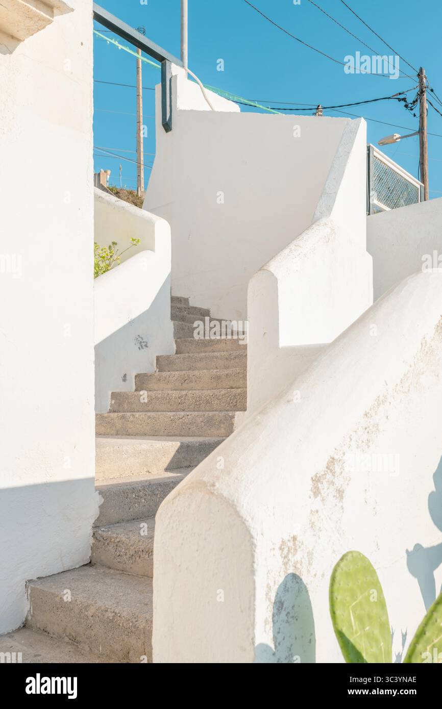 Pristine White Mediterranean Staircase With Curved Walls And Blue Sky ...