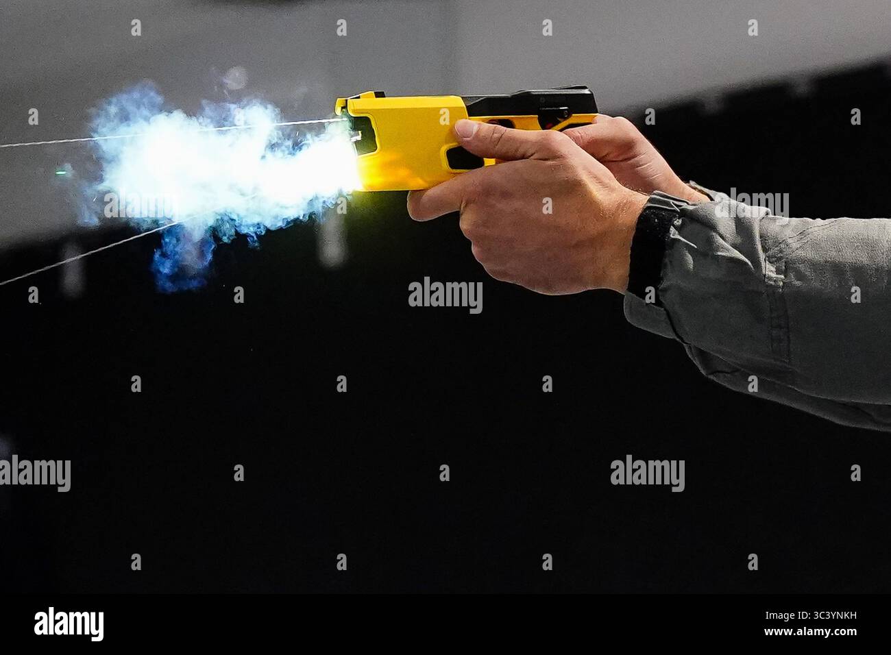 A taser demonstration during the launch of a taser trial in the adult ...