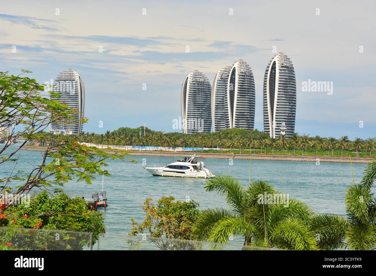 Tourists play at the seaside in Sanya City, southernmost China's Hainan ...