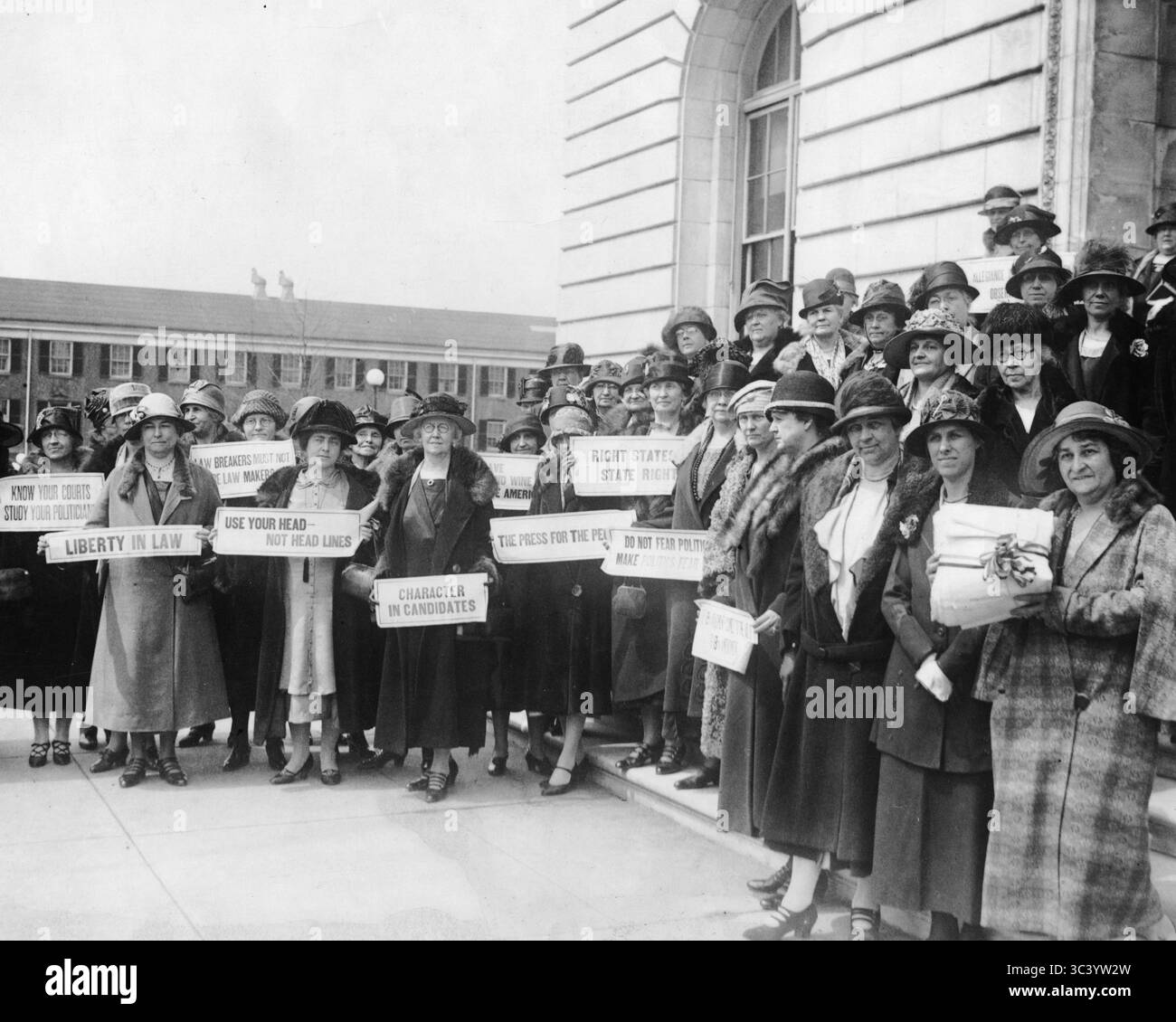 Group of women holding placards with political activist slogans- "know ...