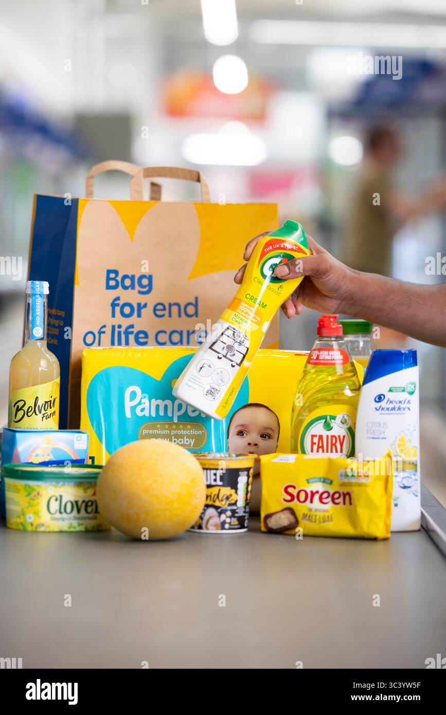 EDITORIAL USE ONLY General view of yellow packaged items at Morrisons ...