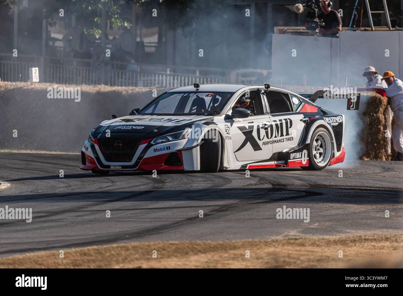 2021 Nissan 'Altimaniac' car driving up the hillclimb track at the ...