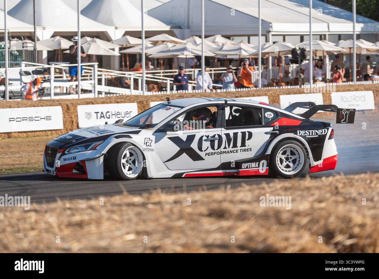 2021 Nissan 'Altimaniac' car driving up the hillclimb track at the ...