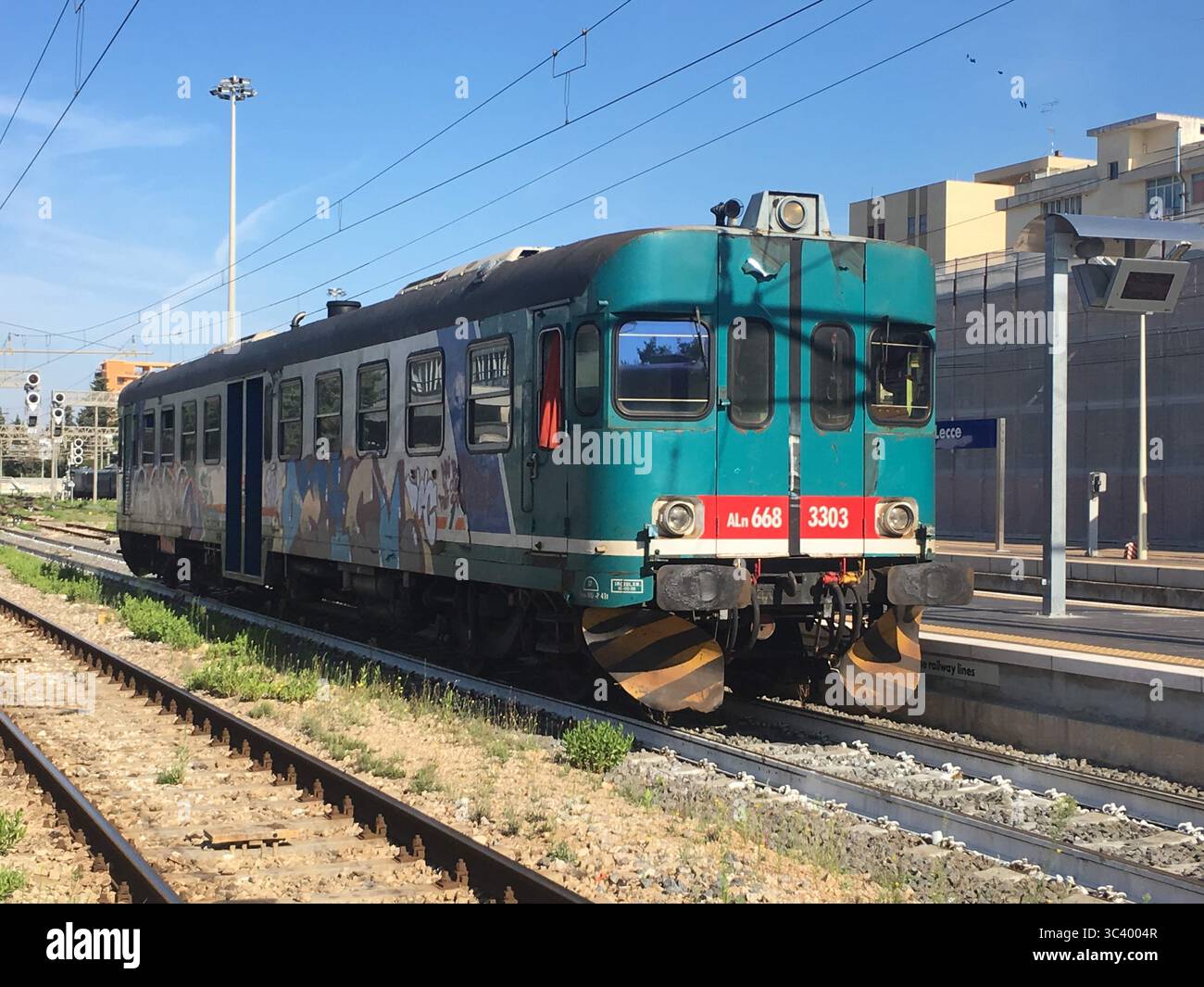 Colorful Italian passenger trains and railway wagons captured in motion ...