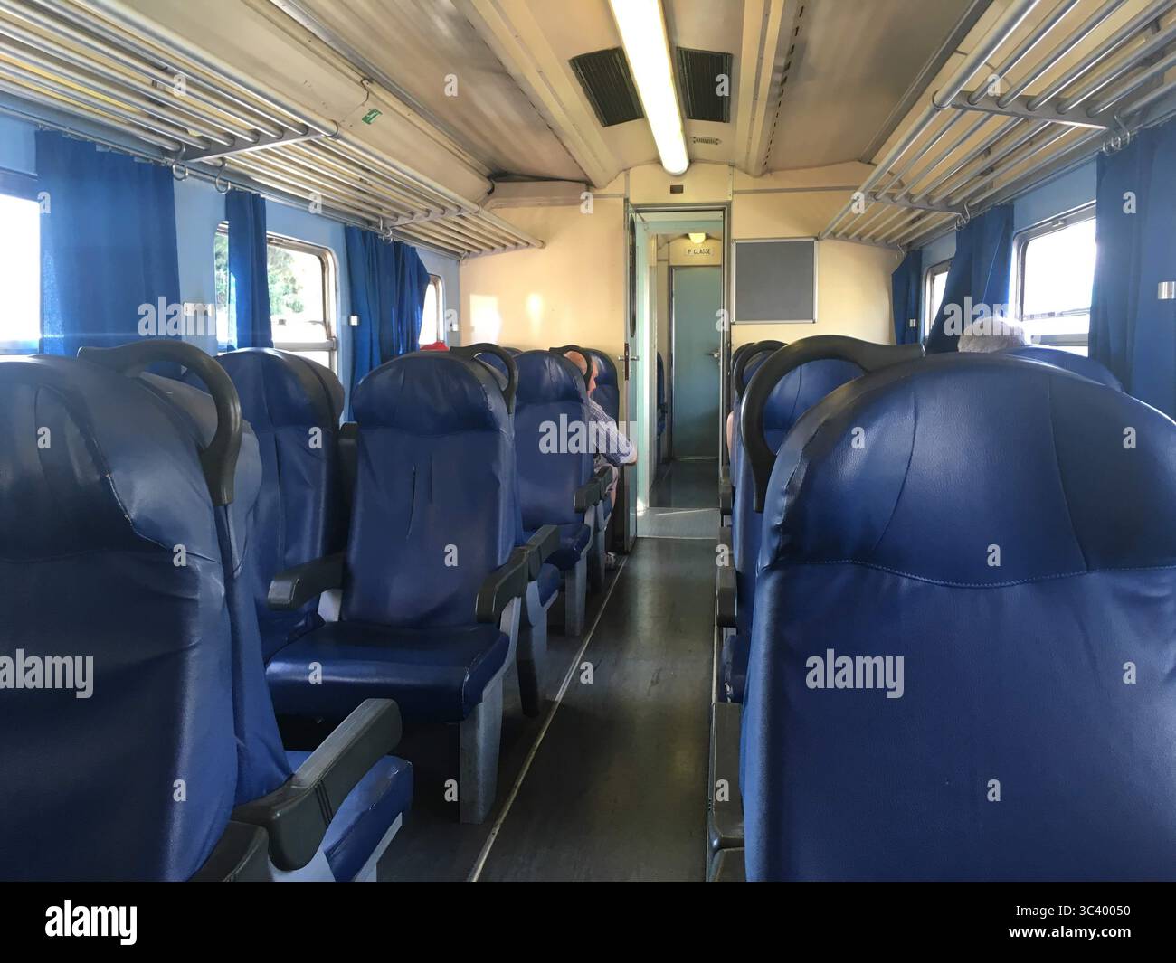 Colorful Italian passenger trains and railway wagons captured in motion ...