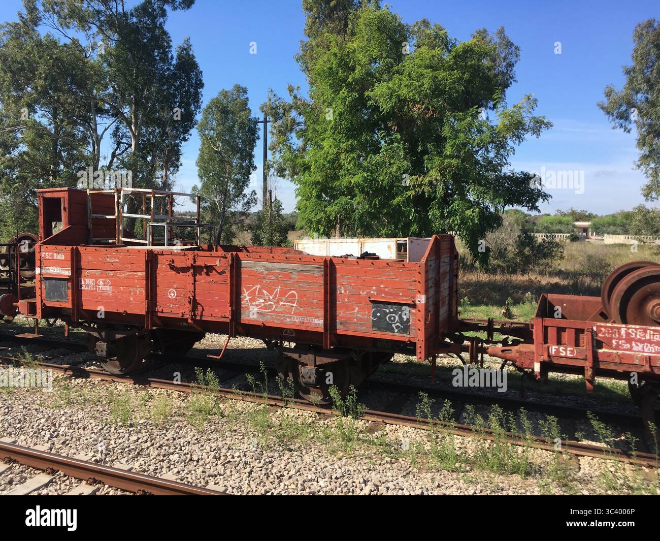 Colorful Italian passenger trains and railway wagons captured in motion ...