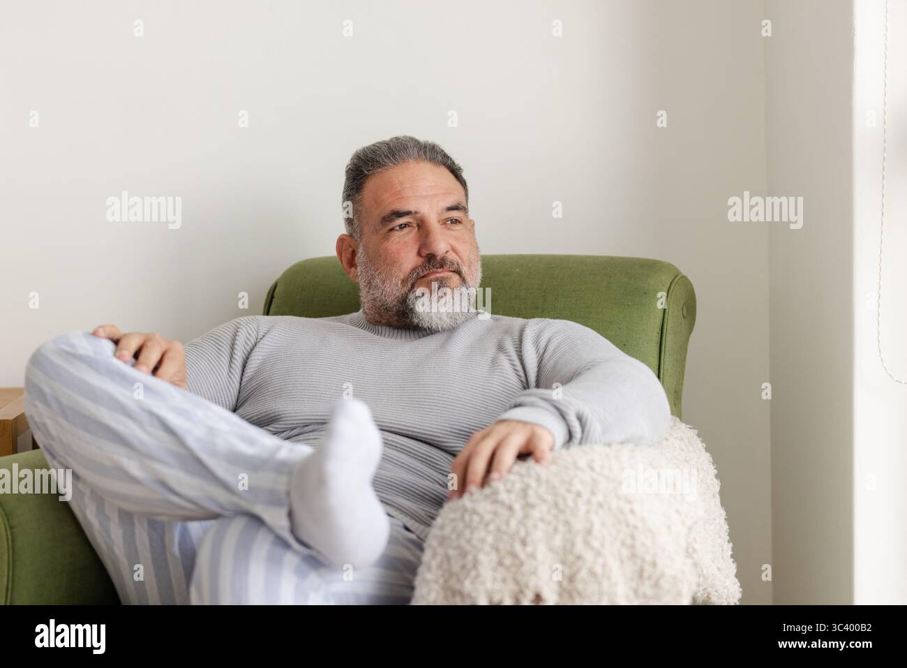 Sitting home elderly man gazing hi-res stock photography and images - Alamy