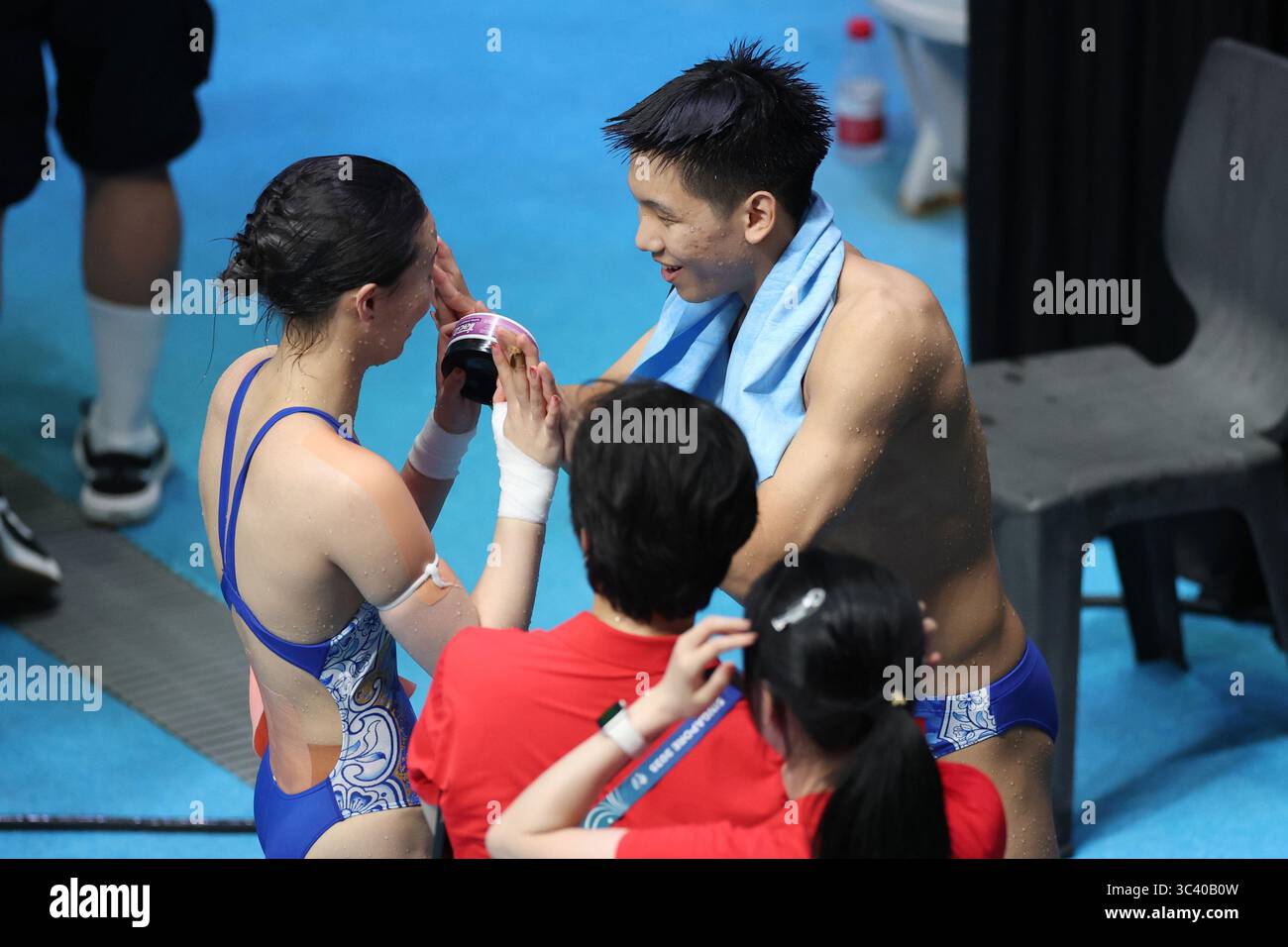 Chen Yuxi (left) and Cheng Zilong high-five after the competition ...