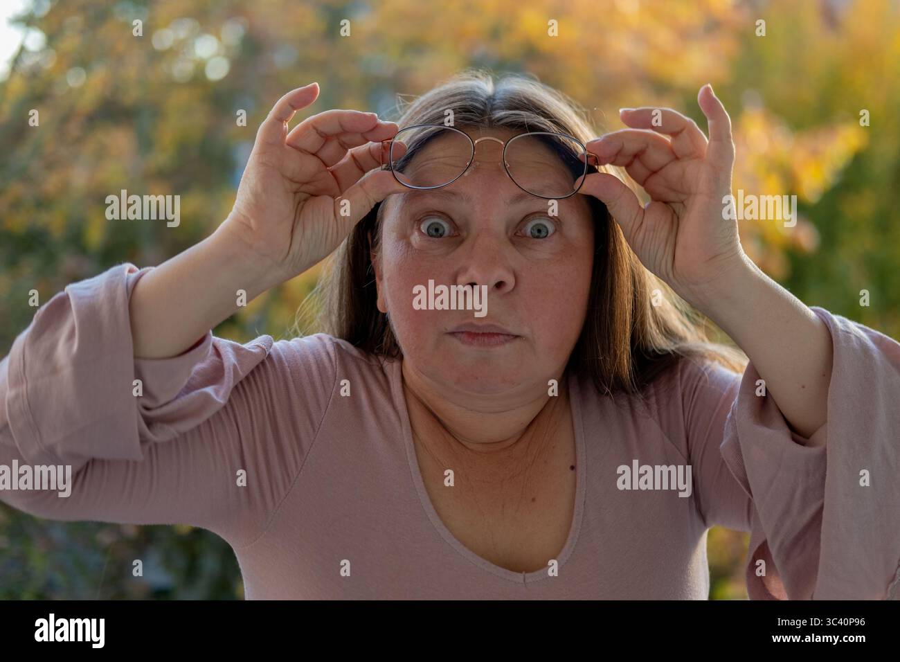 Close-up woman's face showing surprise and fear, frightened and ...