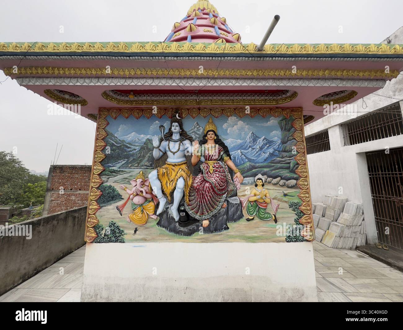 Colourful mural painting of deities on a temple building, Gaya, Bihar ...