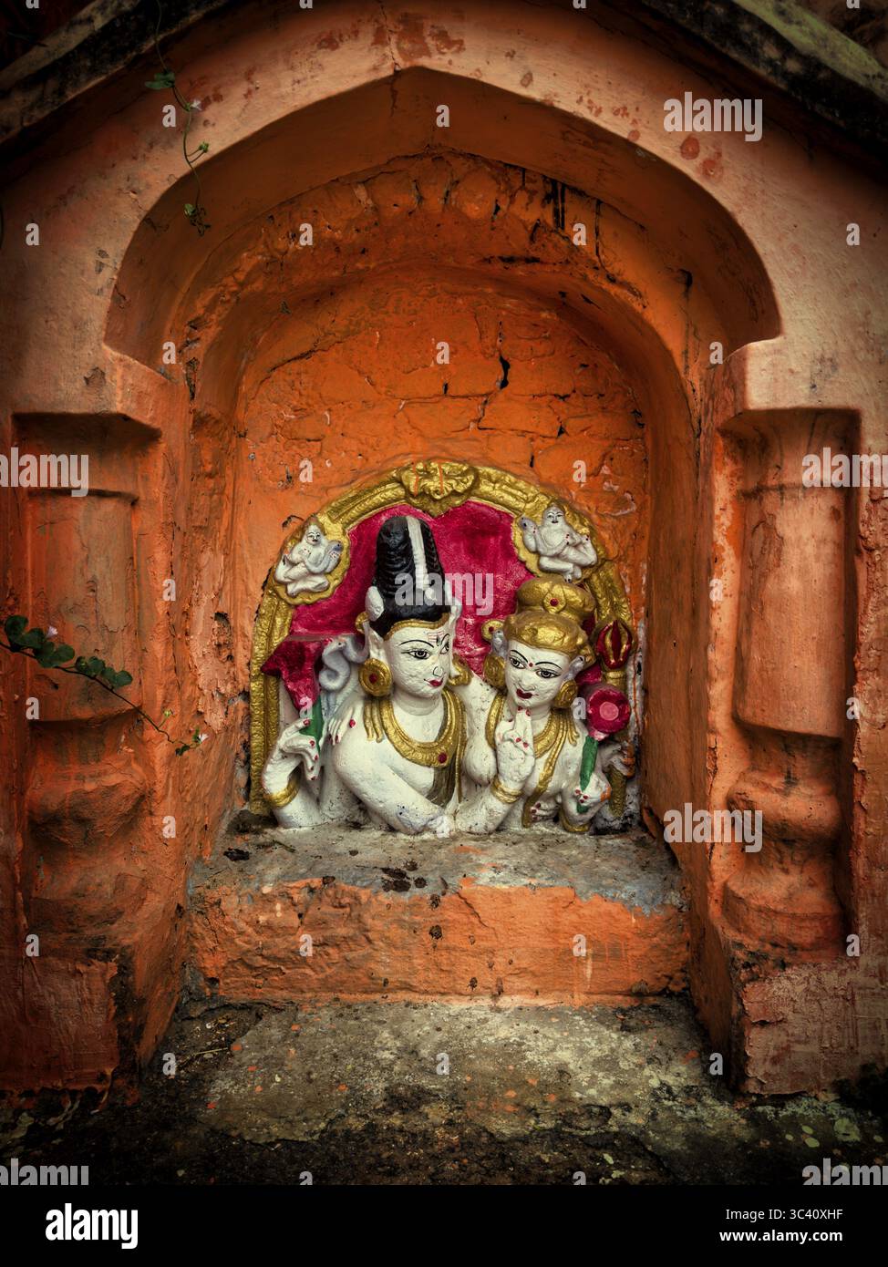 A detailed statue depicting the Hindu gods Shiva and Parvati, in an ...