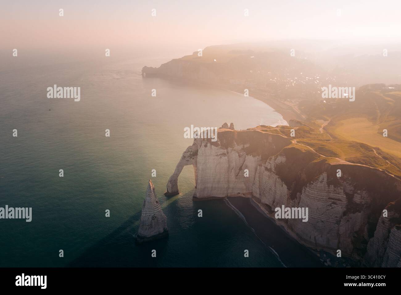 Aerial view of the dramatic cliffs meeting the sea at the iconic arch ...