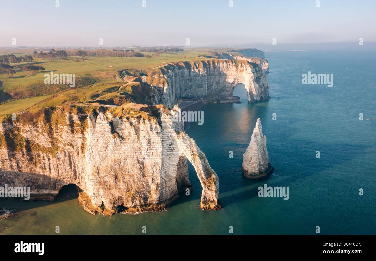 Aerial view of dramatic white cliffs meet the turquoise sea ...