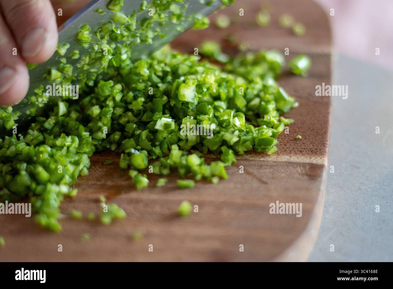 Slicing garlic on wooden cutting hi-res stock photography and images ...
