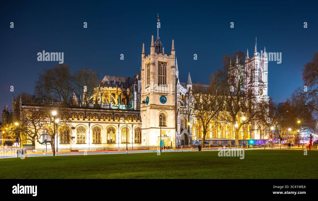 Illuminated Westminster Abbey stands tall against the night sky in ...