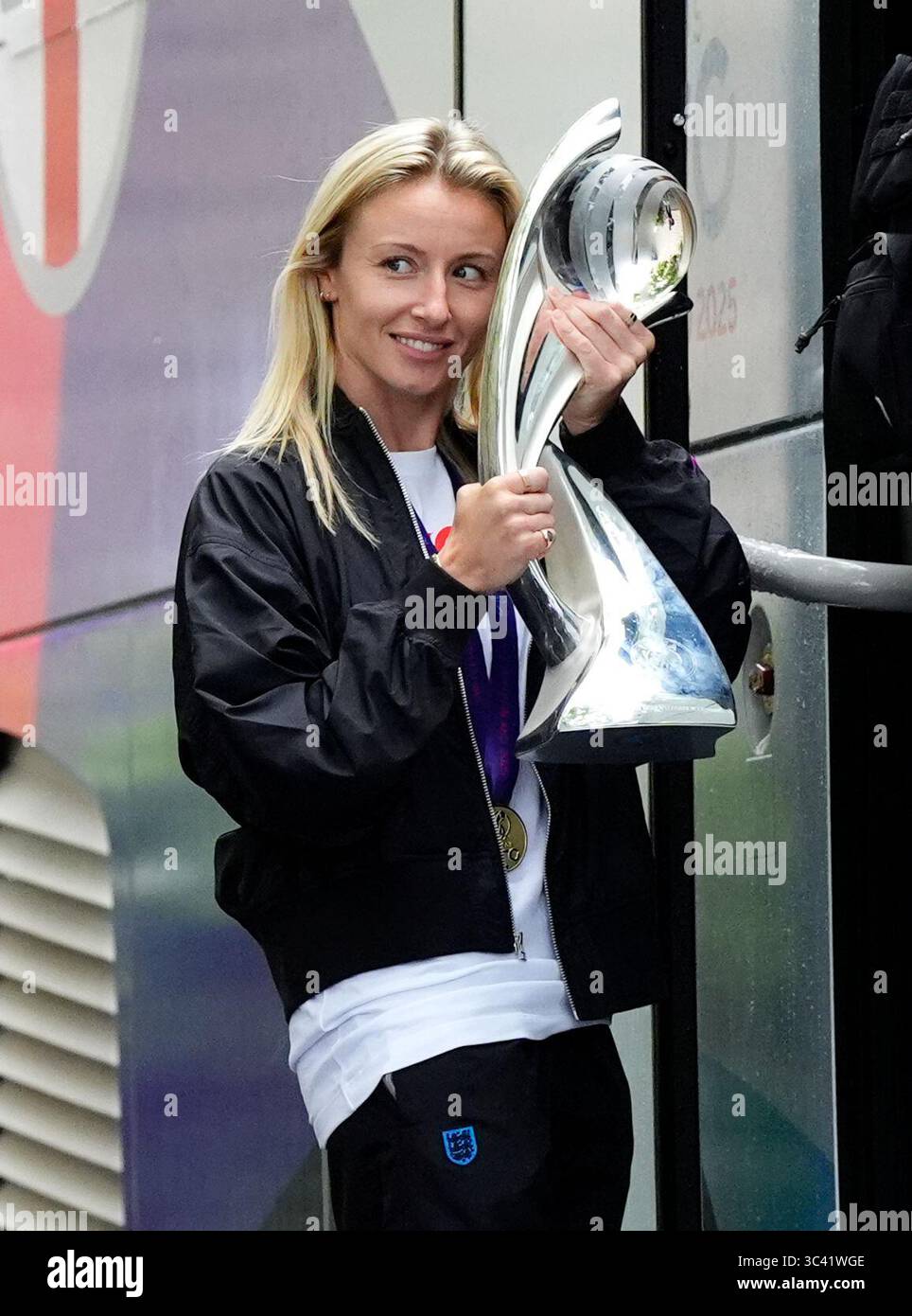 England captain Leah Williamson with the trophy leaving the team hotel ...