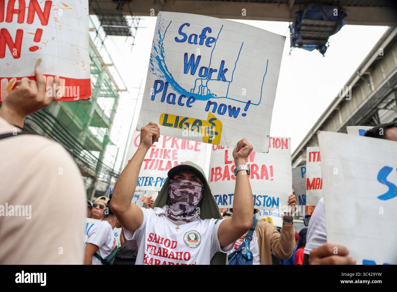 A man holds a sign during a protest in time for Philippines President ...